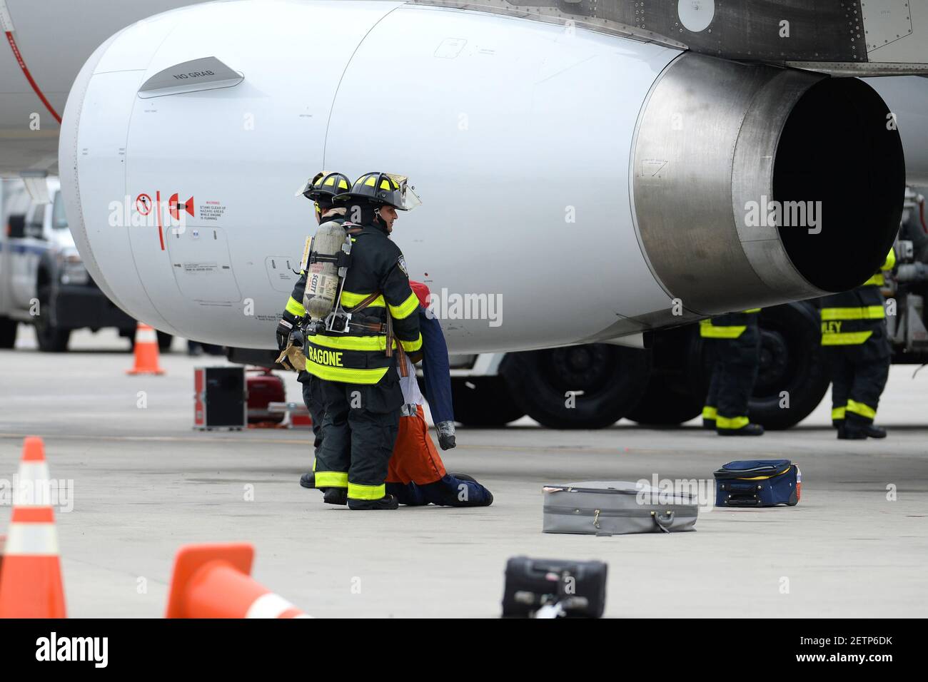 Emergency responders tend to a dummy victim during the Port Authority ...