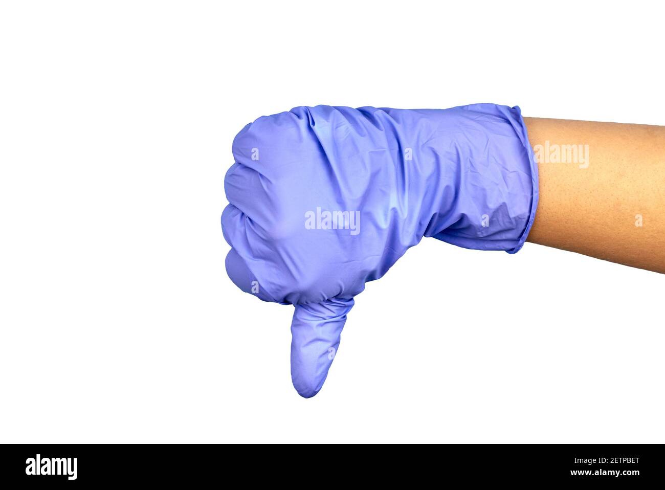 Woman's hand in a medical glove shows a thumb down gesture isolated on ...