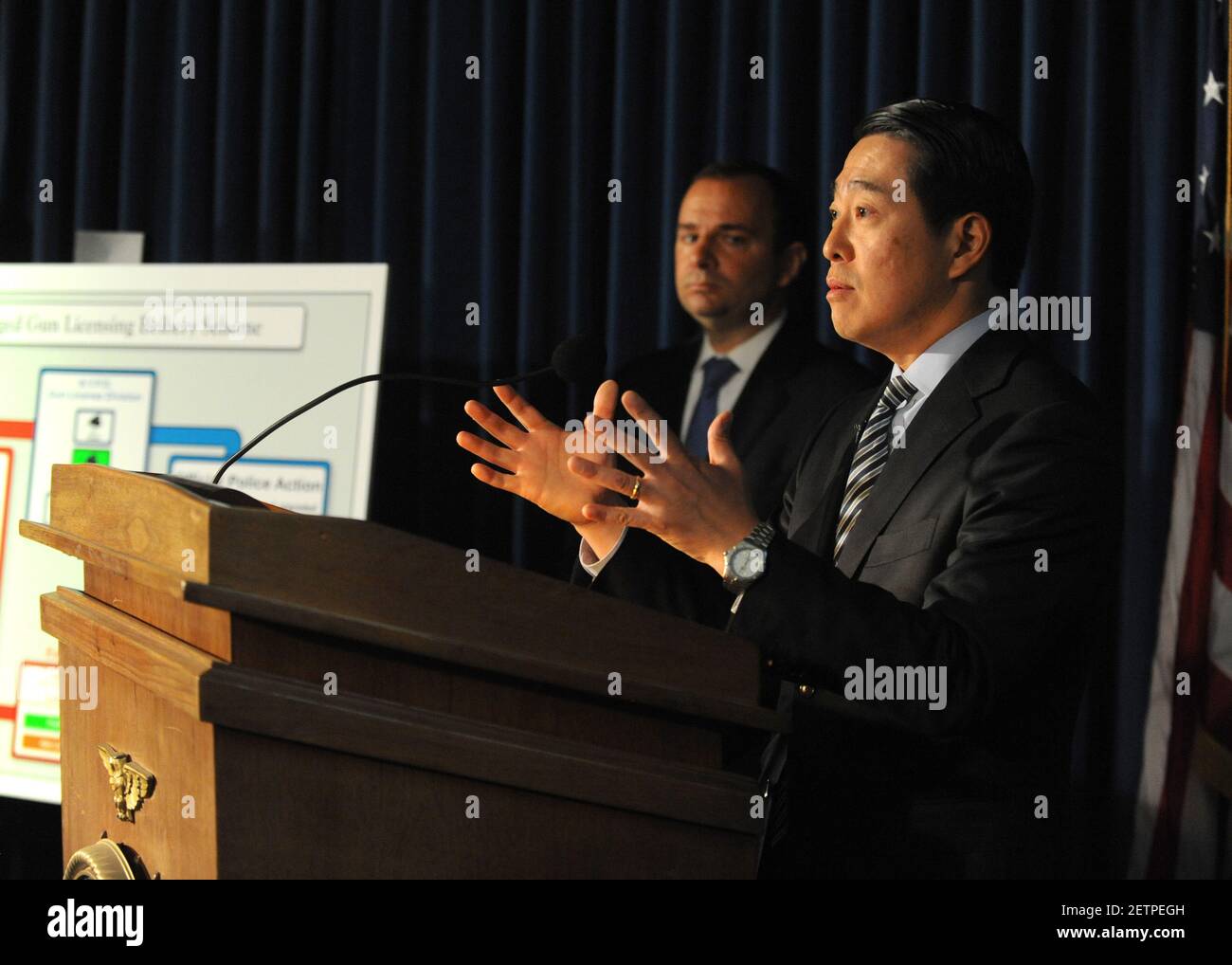 Acting US Attorney Joon H. Kim announces the arrest of former police ...