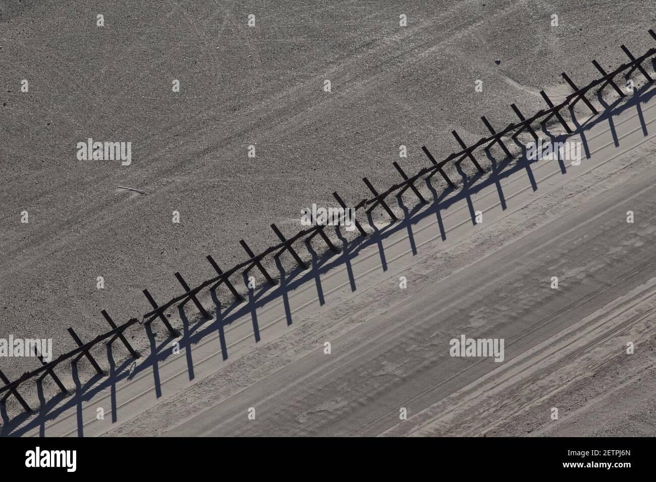 West of Calexico, the tall fence ends and drive through barriers are ...