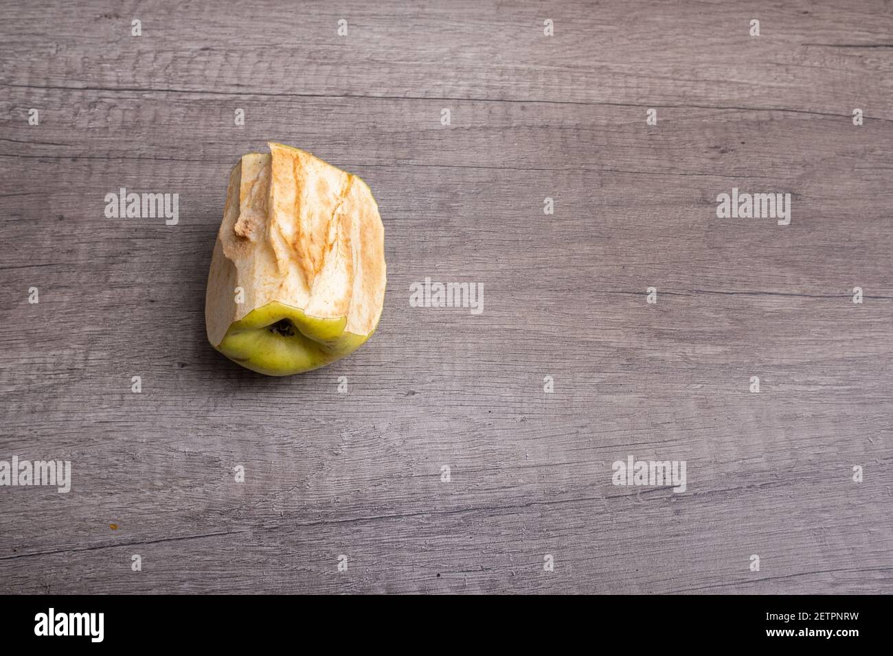 Damaged apple on wood background. Rotten apple on table top.how to keep ...