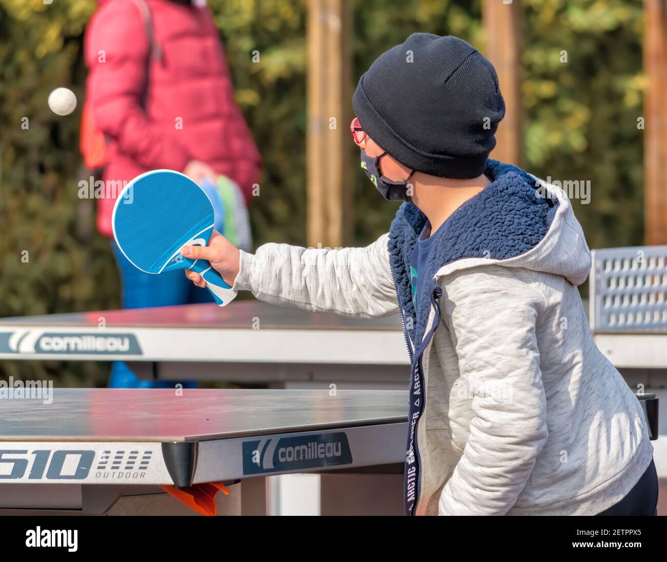 Bucharest, Romania - 02.13.2021: Young adult playing ping pong or table tennis in Drumul Taberei ...