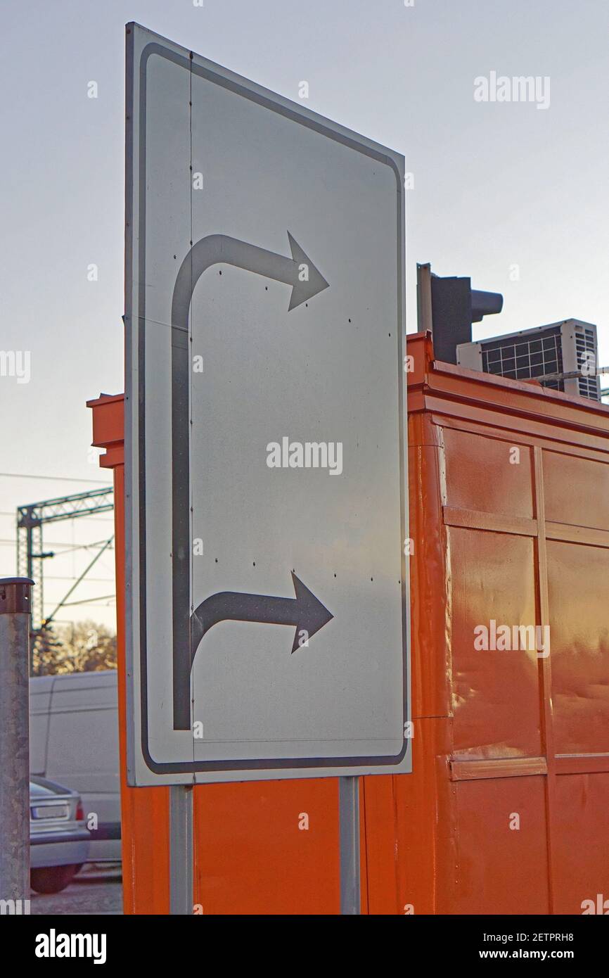 Direction arrows at white information board traffic sign Stock Photo ...