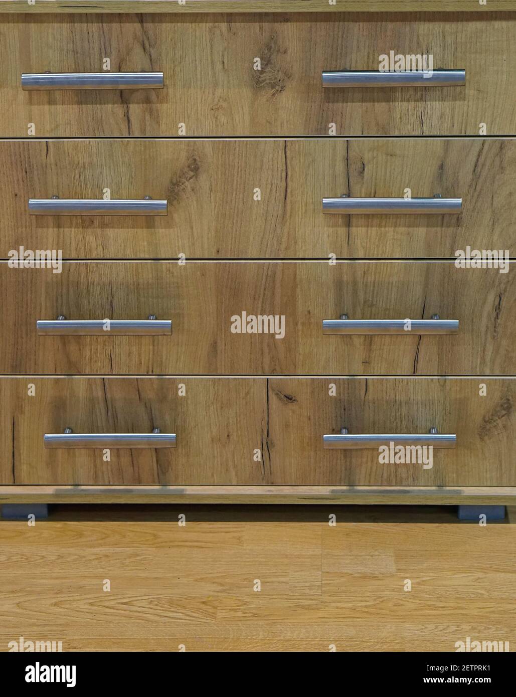 Modern wooden cabinet with drawers in home Stock Photo - Alamy