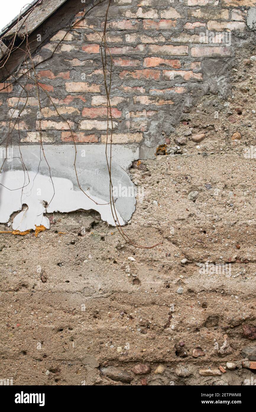 Poor wall repair for an old wall with a modern approach Stock Photo - Alamy