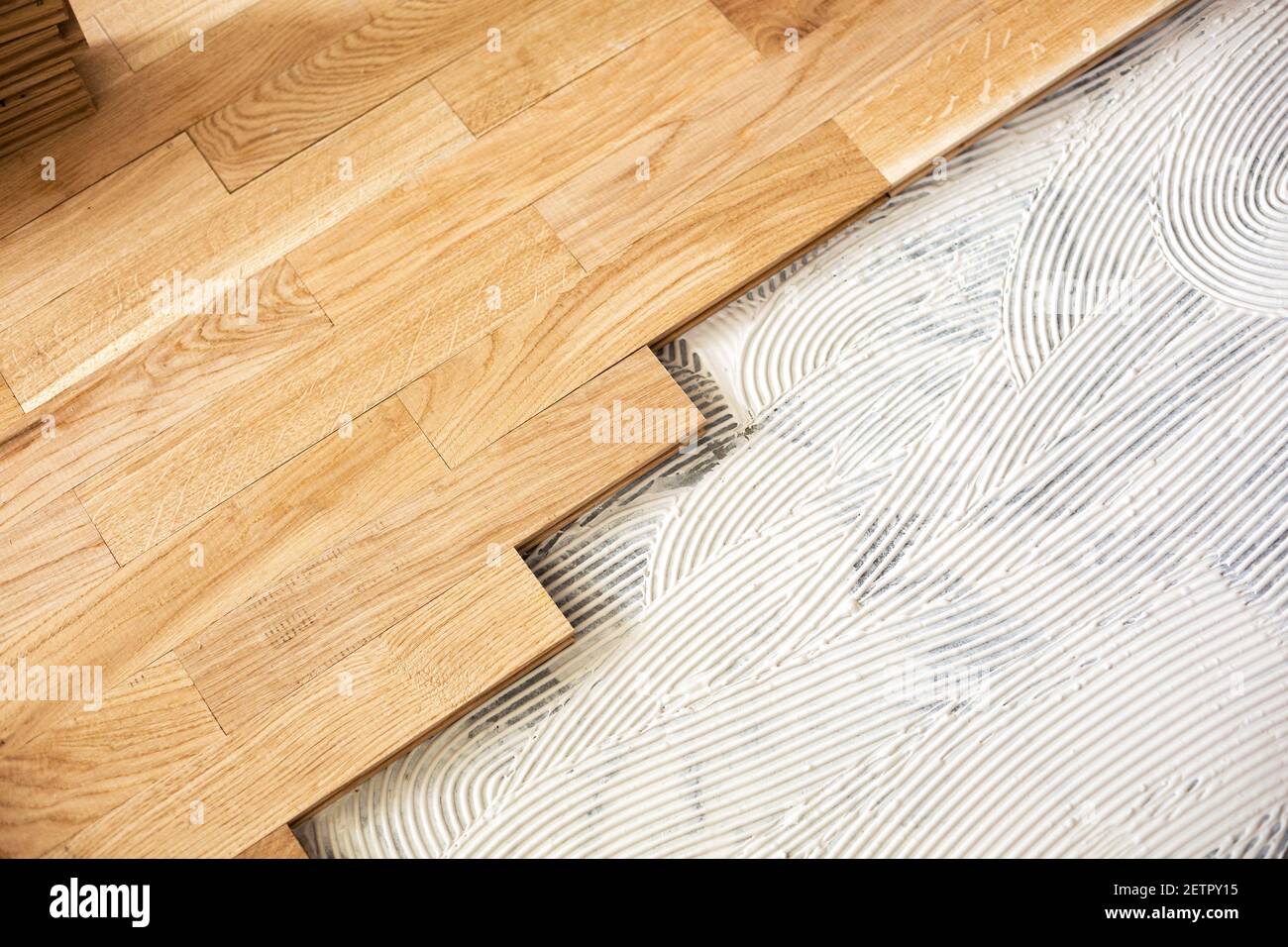 A closeup of subfloor mixture and assembled parquet plates in the ...