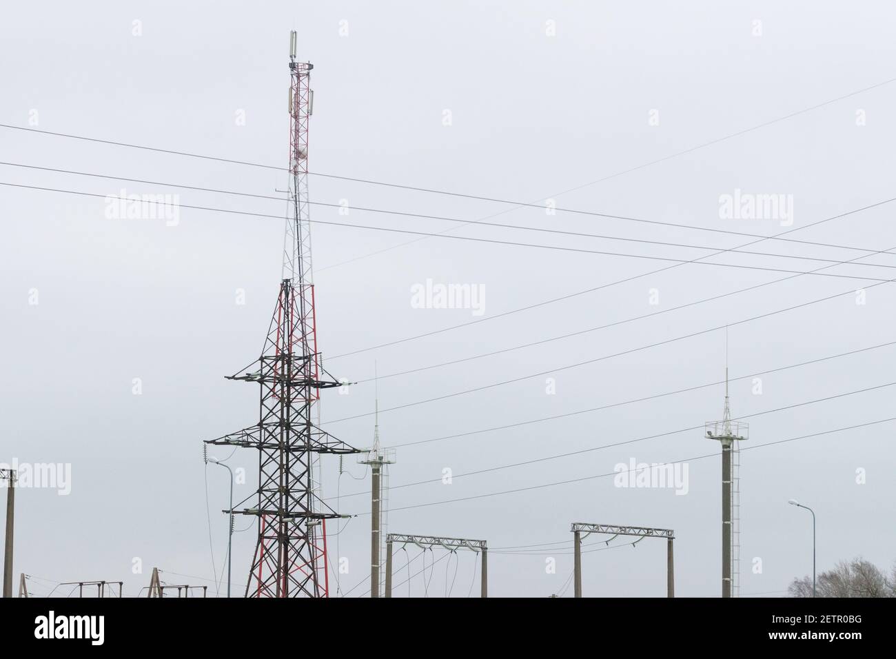 The power lines cross each other next to the transformer station in ...