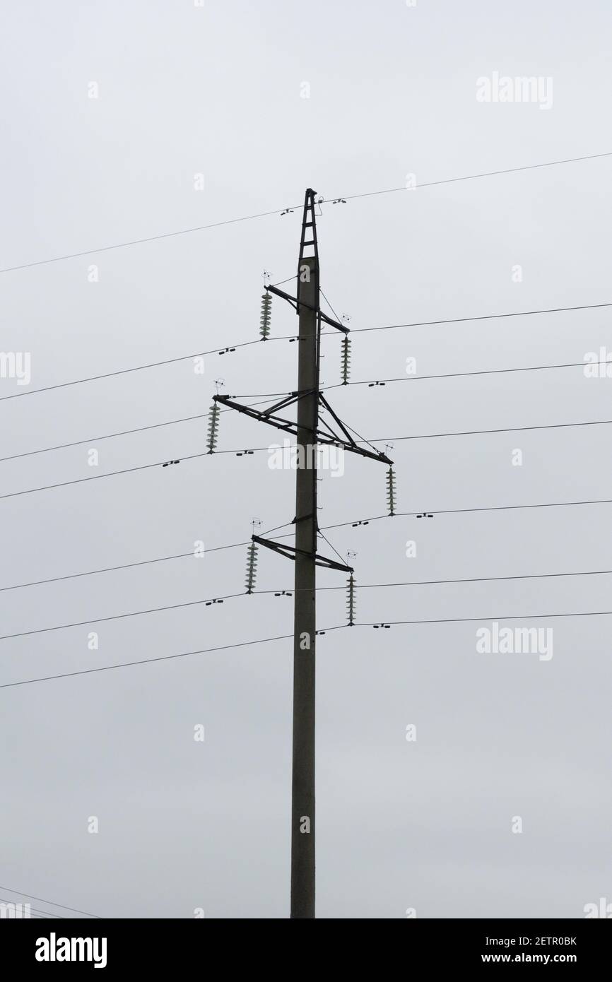 Power lines with multiple wires during a cloudy day. Preparing for a ...