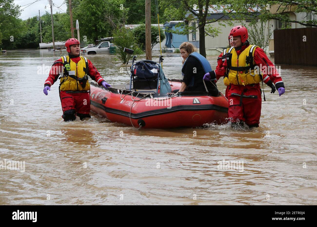 Members of the High Ridge fire department take a woman out of her ...