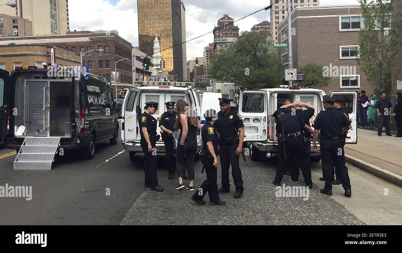 Hartford police officers detain protesters on Main Street after they ...