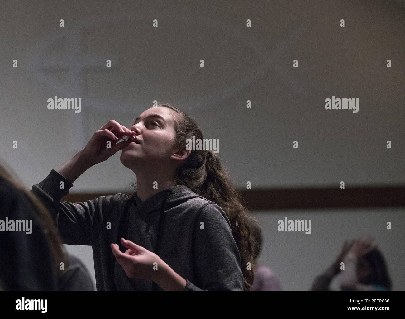 Laura Landini, 14, receives communion at Transfiguration Lutheran ...