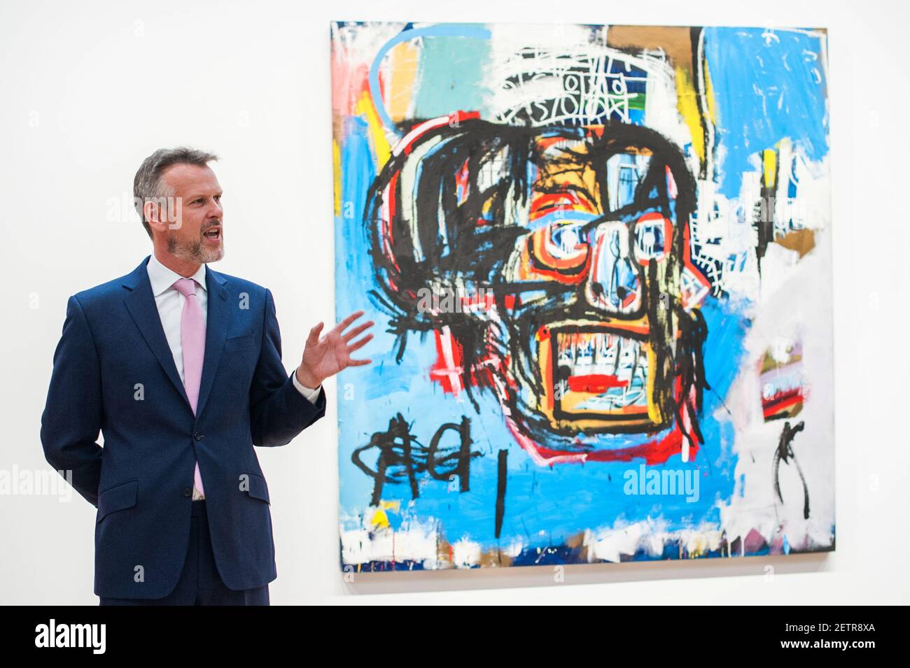 Simon Shaw speaks in front of Untitled dated 82 by Jean-Michel Basquait ...