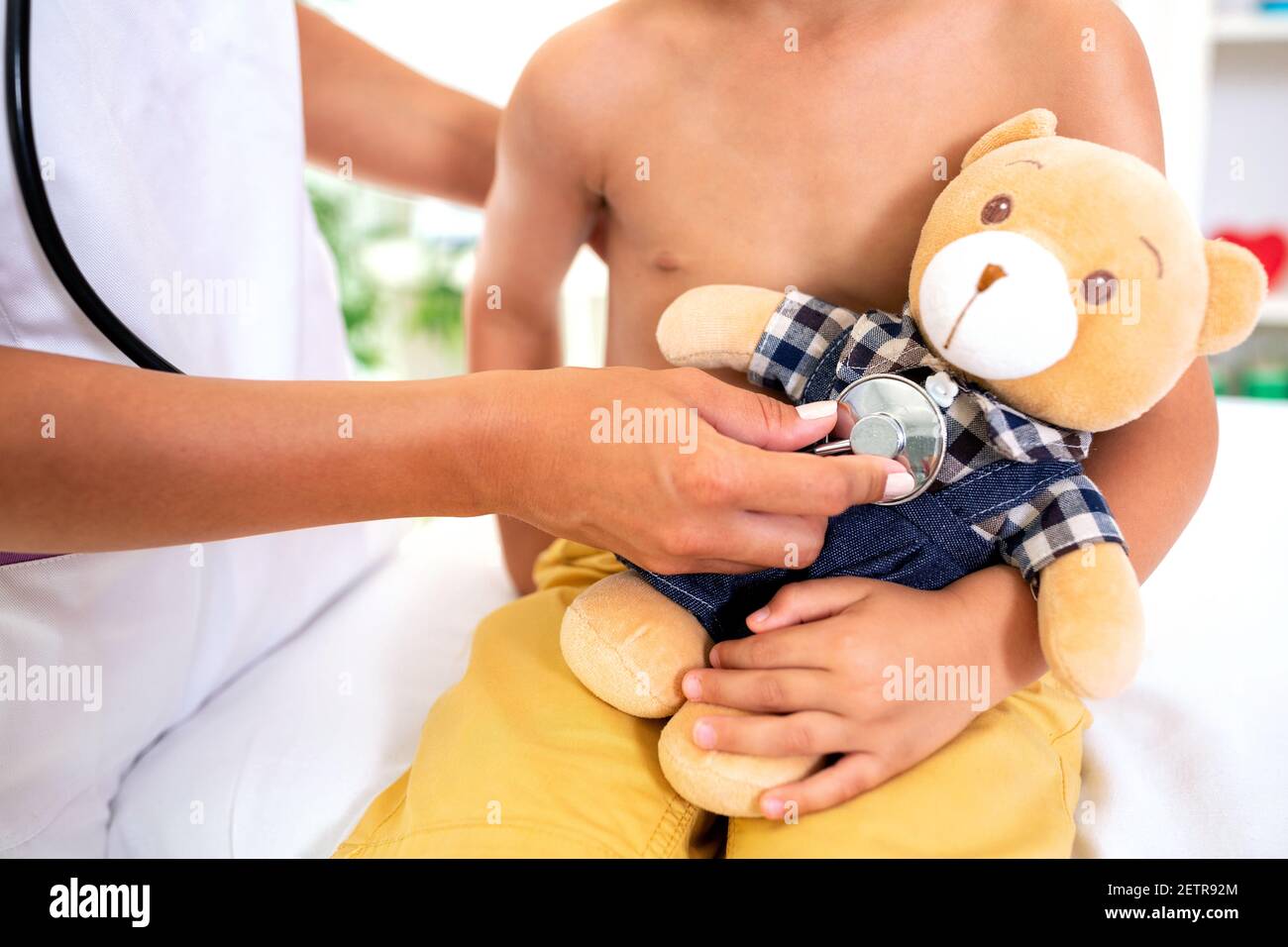 Teddy bear being checked for a heartbeat with stethoscope Stock Photo ...