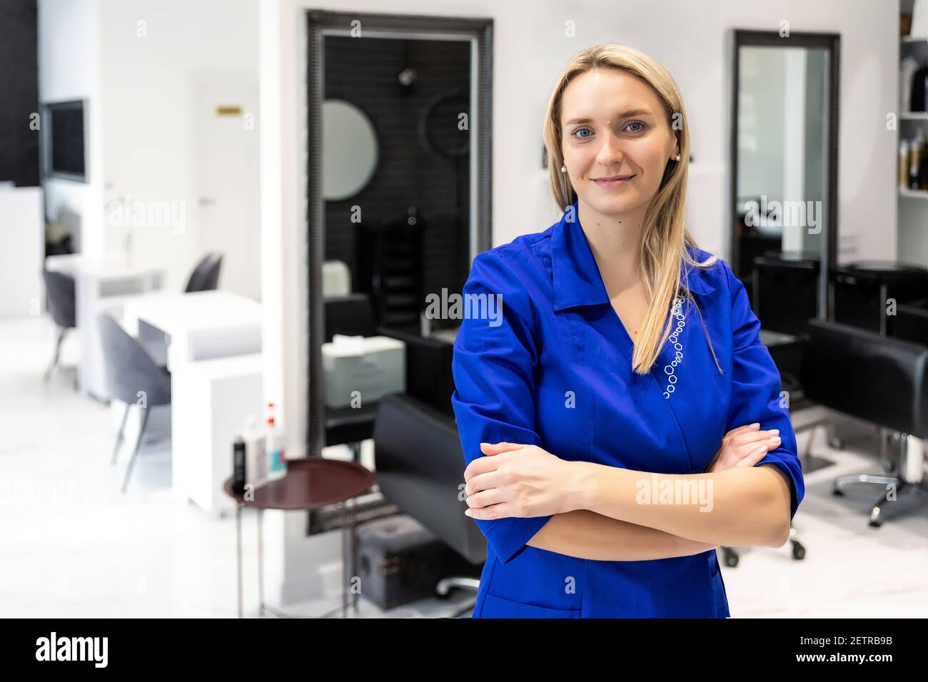 Young attractive confident professional beautician doctor portrait in ...
