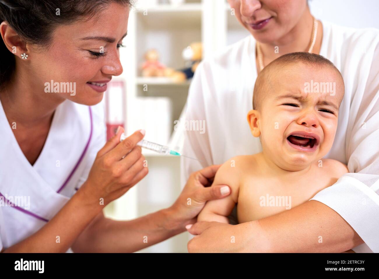 Baby crying after a vaccine wishing sting never happened Stock Photo ... Baby crying after a vaccine wishing sting never happened Stock Photo ...