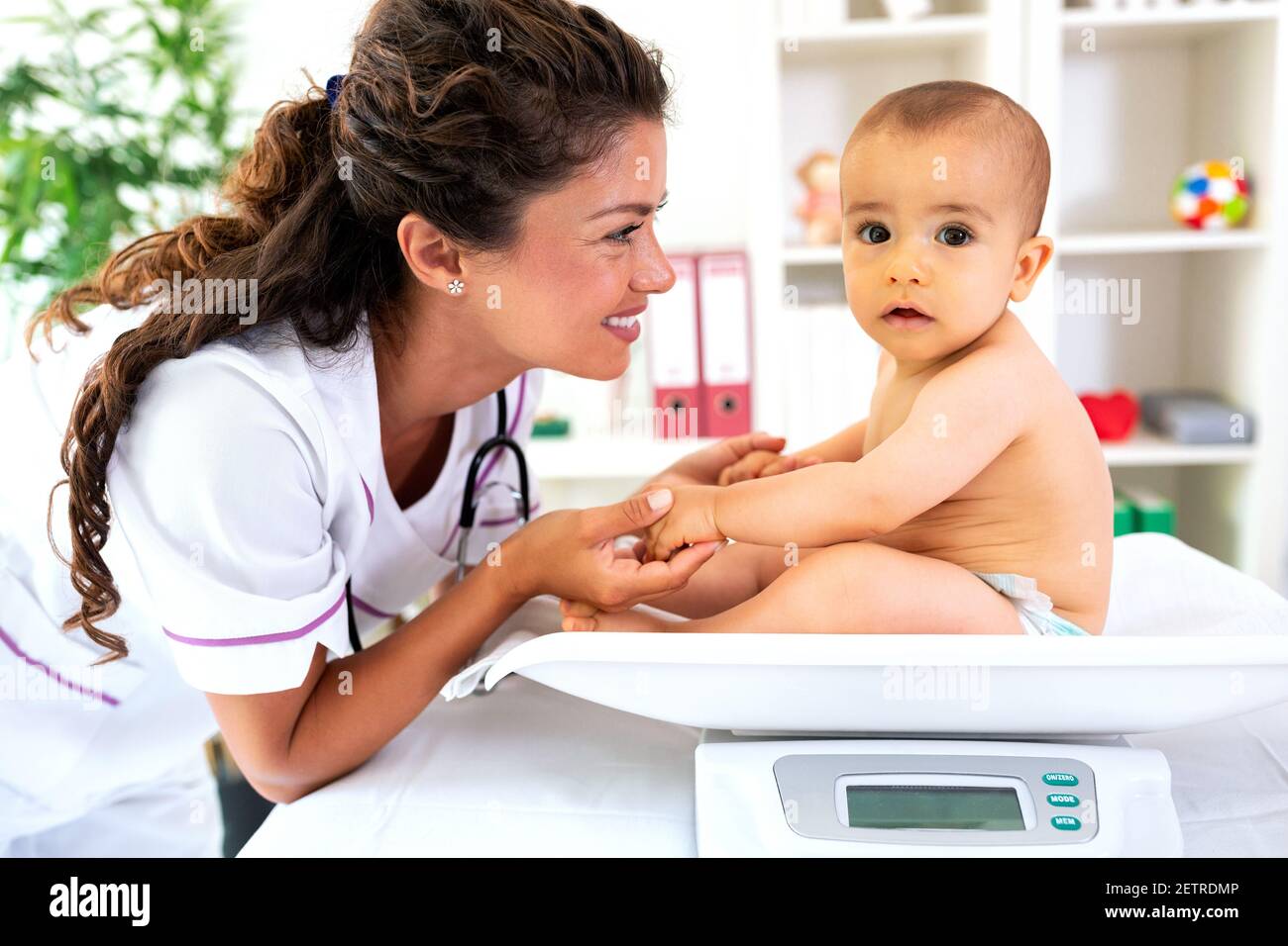 Nurse Weighing Patient On Scale High Resolution Stock Photography and ...