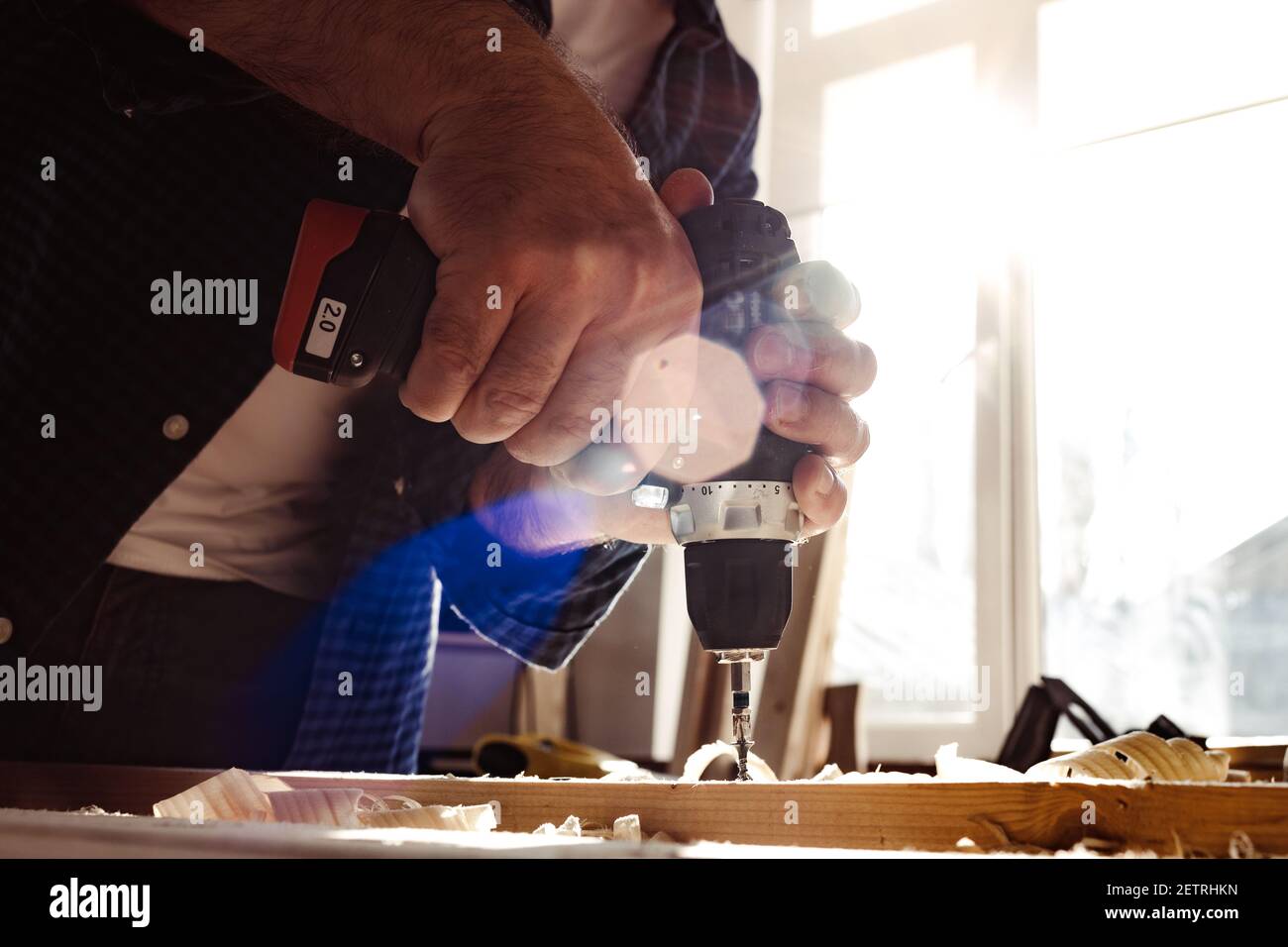 Close up of a carpenter drilling a hole in timber Stock Photo - Alamy