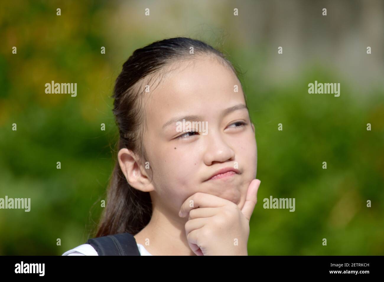A Filipina Girl Student Thinking Stock Photo - Alamy