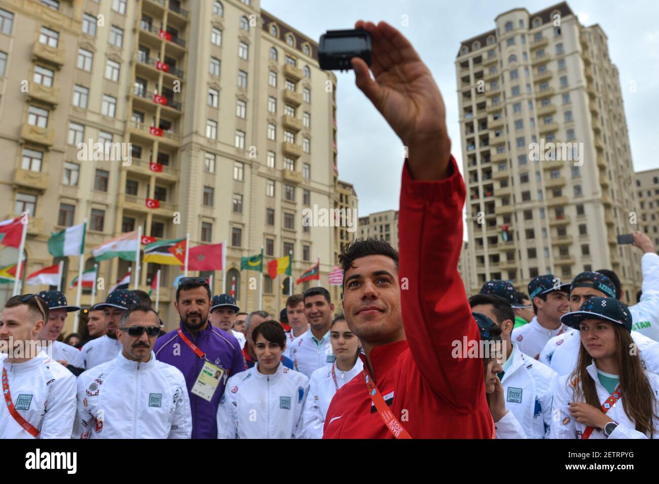 A Syrian athlete takes a selfie in front of the crowd during Athletes ...