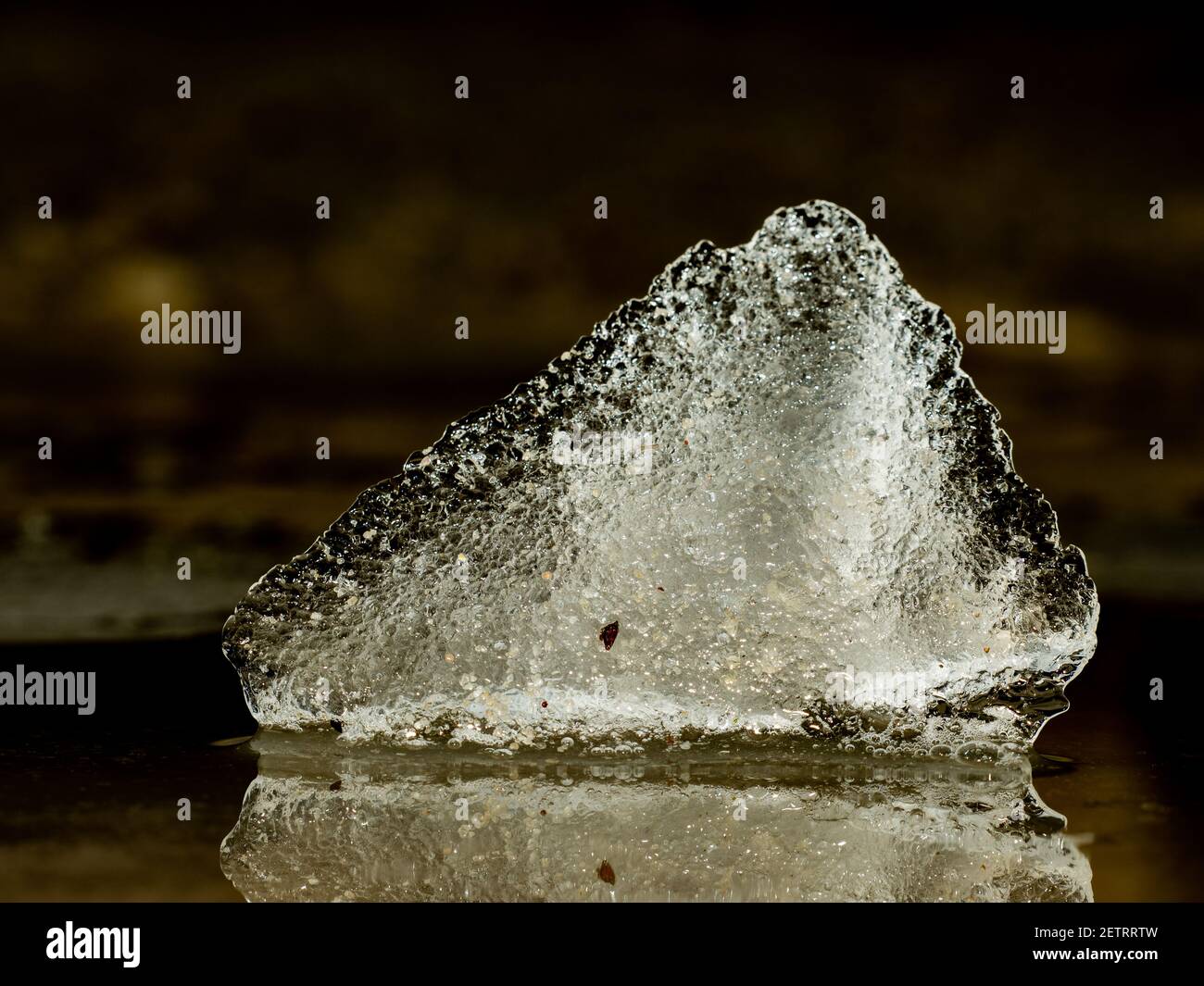 Shining sharp ice piece from broken ice floe. Spring warm days begun ...