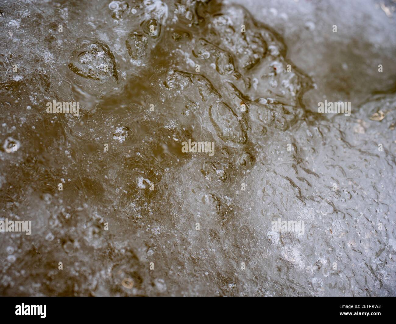 Melting ice pieces flowing on water surface. Ice drift on the river ...