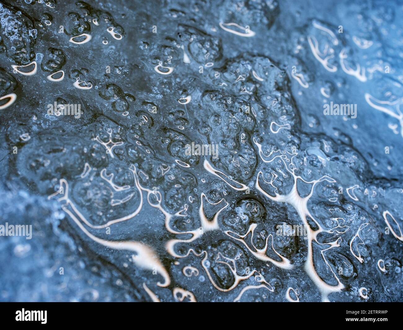 Detailed melting ice on the beach. Bizarre patterns of ice blocks in ...