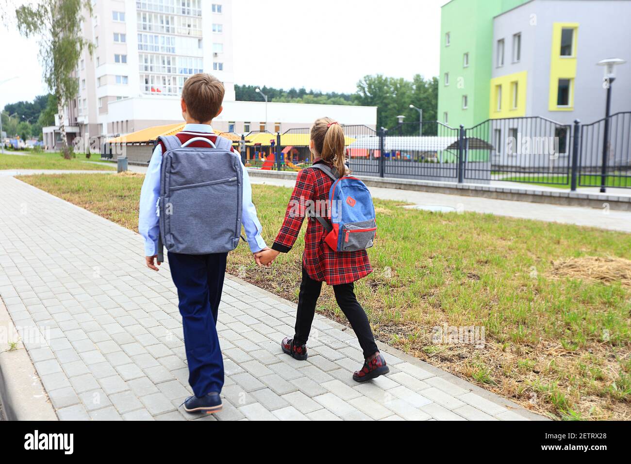 Children with briefcases over their shoulders on the background of the ...