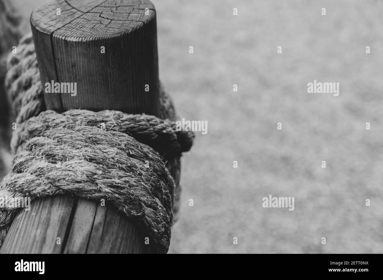 Old rope tied wooden pole Black and White Stock Photos & Images - Alamy