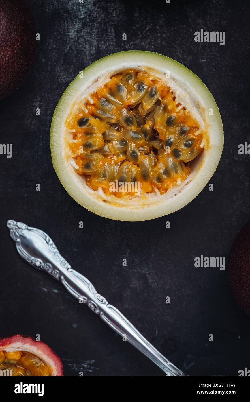 Fresh and juicy raw maracuja fruit on a table Stock Photo - Alamy