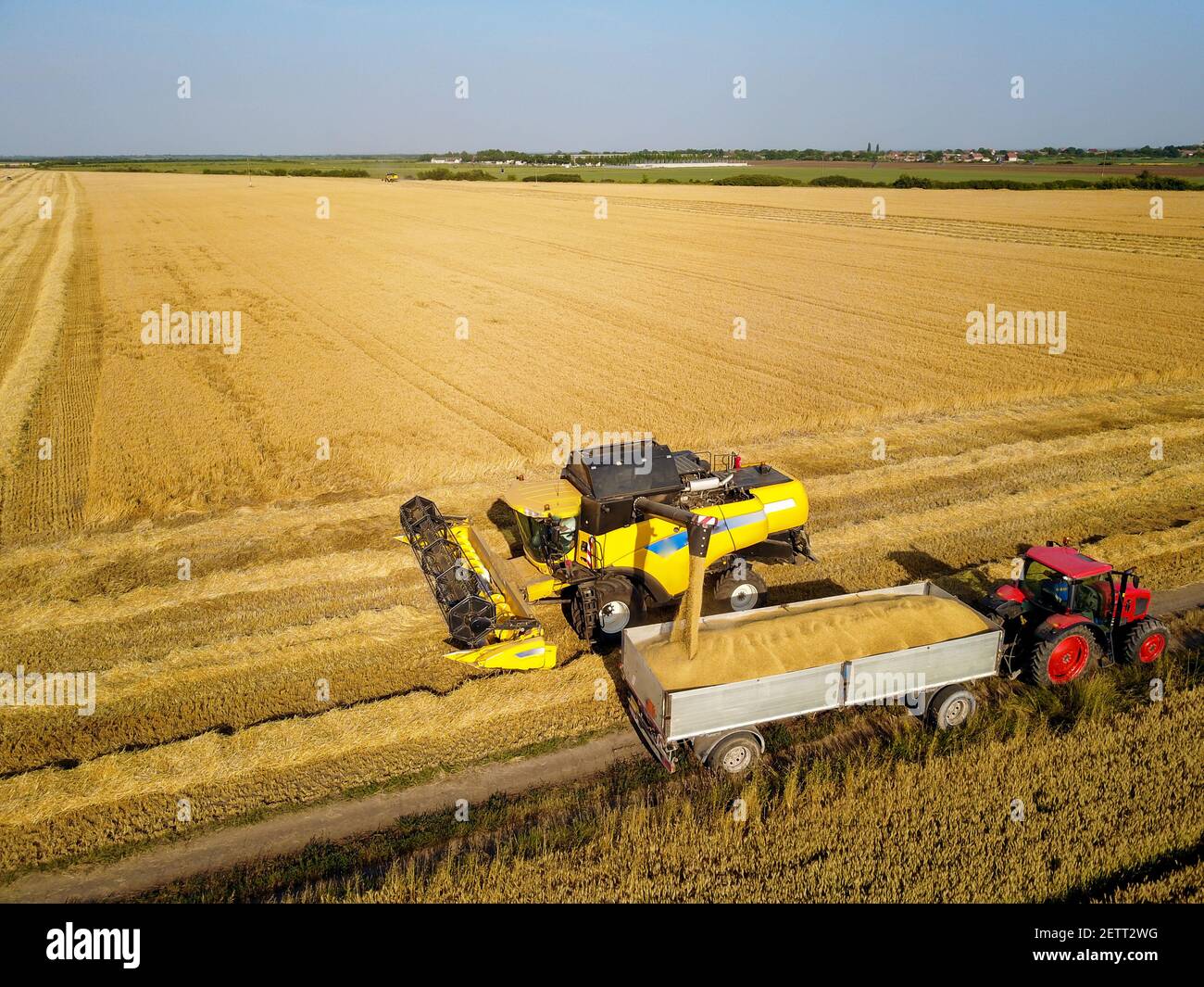 Bird's eyes of large professional combine harvester loading grain into ...