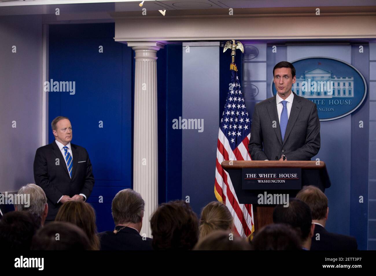 As White House Press Secretary Sean Spicer looks on, Tom Bossert, White ...