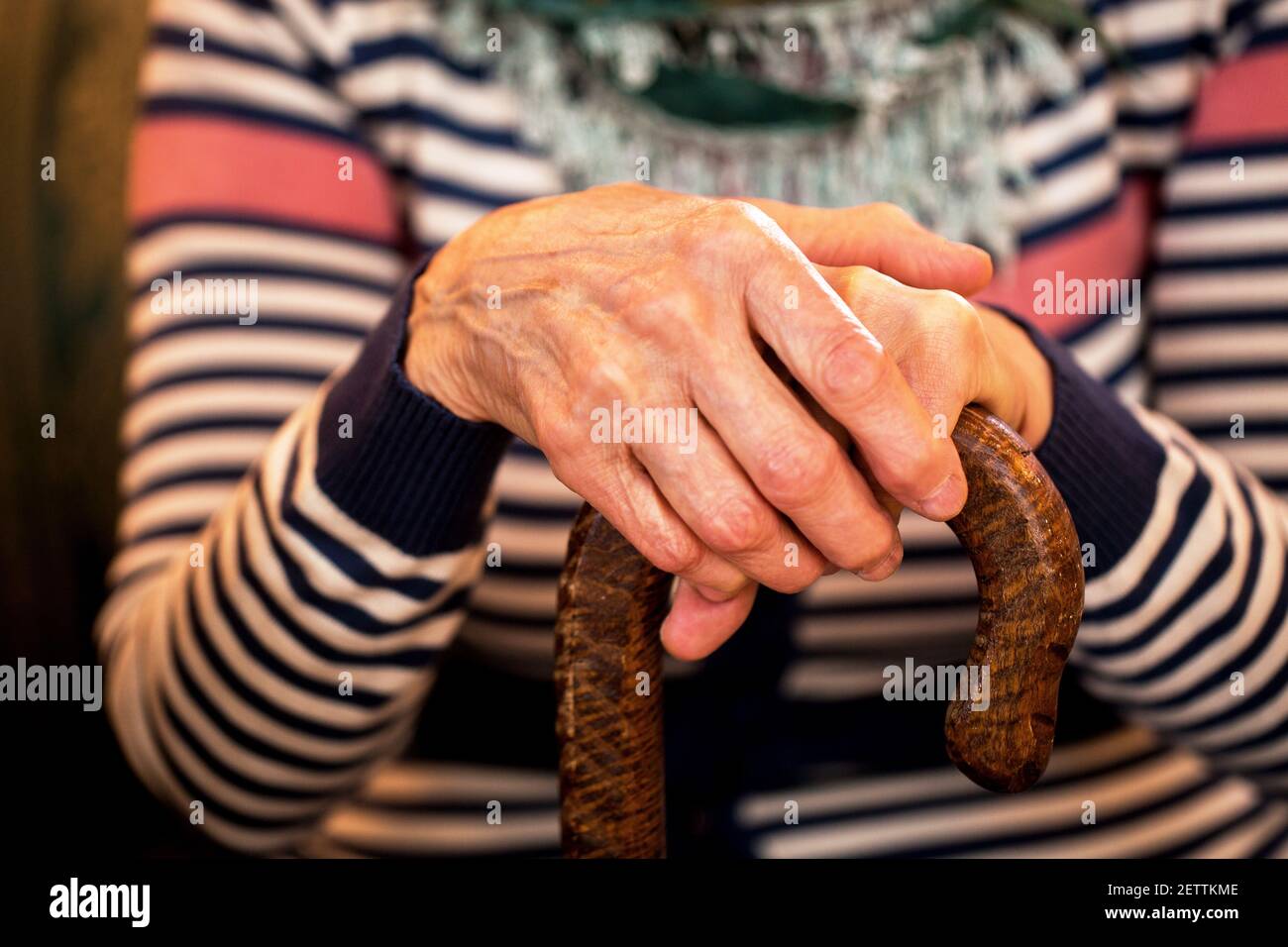 Close up of old woman hands holding stick Stock Photo - Alamy