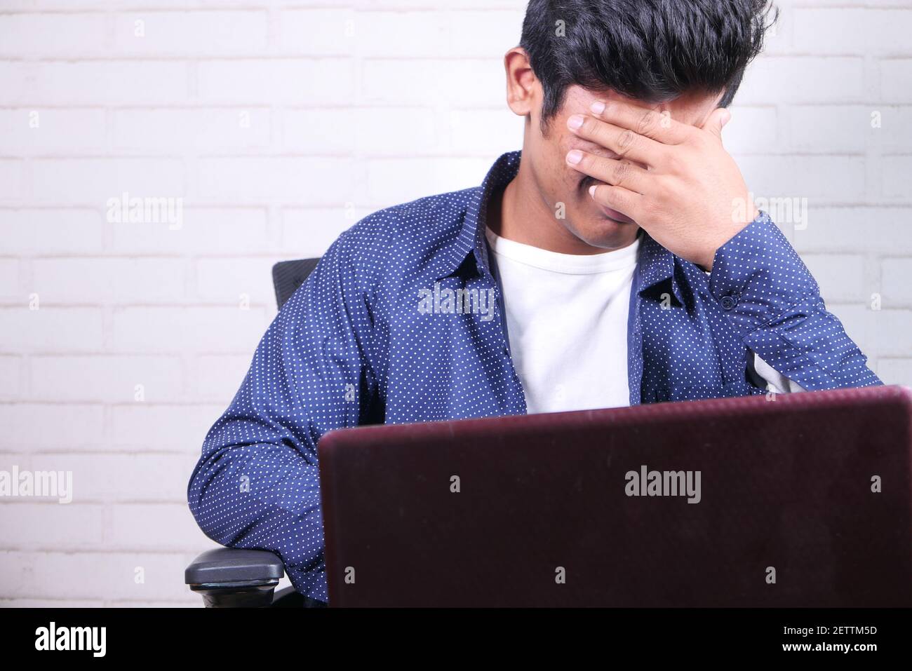 Close up of sad man covering face with hand Stock Photo - Alamy