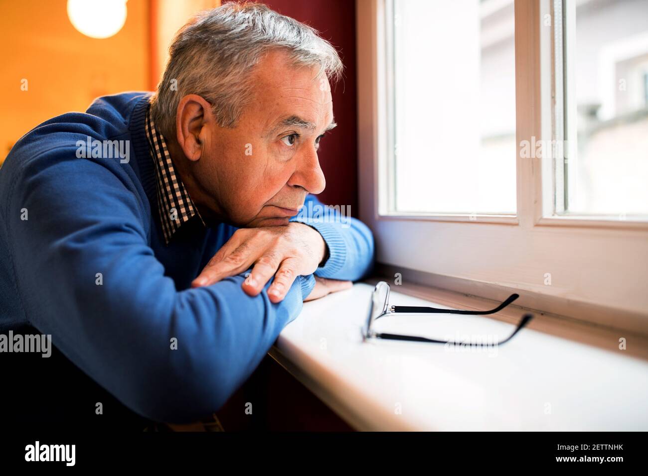 Sad depression man, senior forgot by family at nursing home Stock Photo ...
