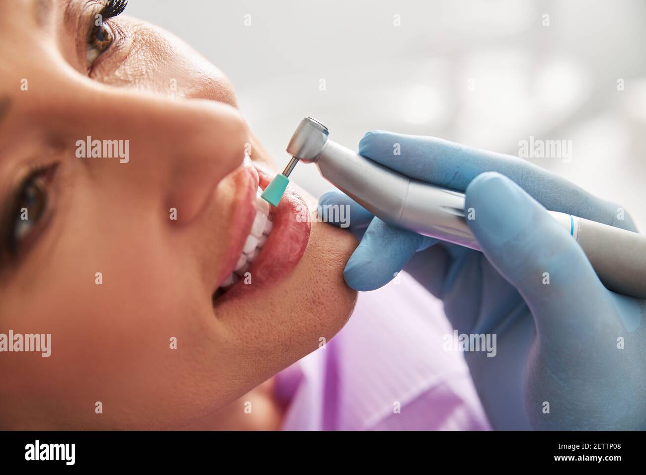 Handpiece with a rubber cup polishing lady teeth Stock Photo - Alamy