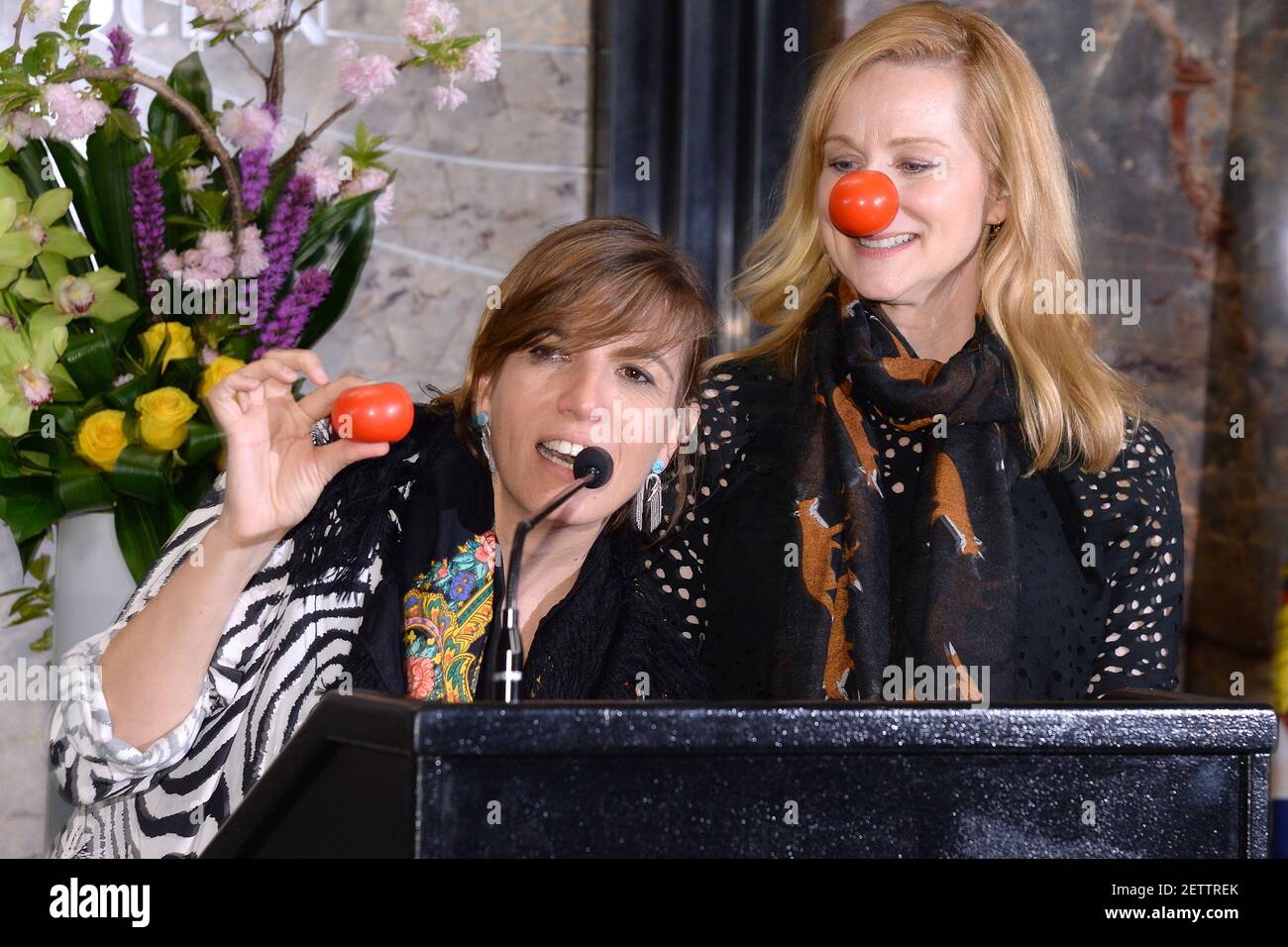 (L-R) Actresses Lucia Moniz and Laura Linney light The Empire State ...