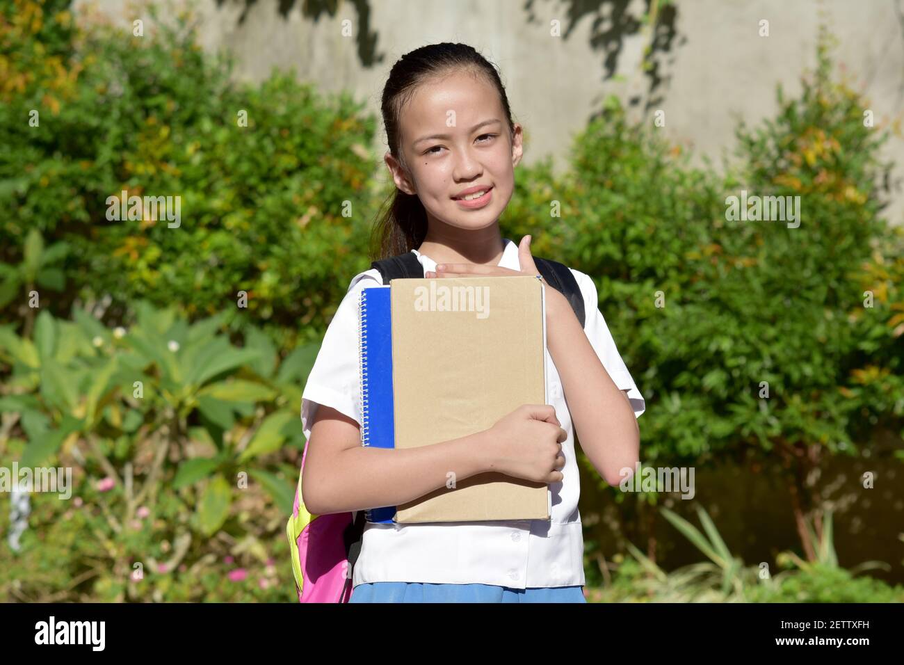 Female Student And Appreciation With Books Stock Photo - Alamy