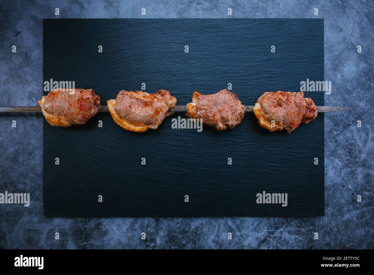 Skewers of grilled shish kebab or barbecued shashlik meat Stock Photo ...