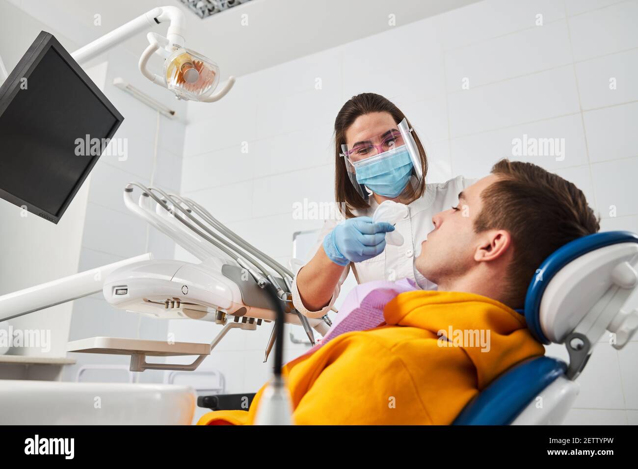 Stomatologist in the process of putting mouth opener Stock Photo - Alamy