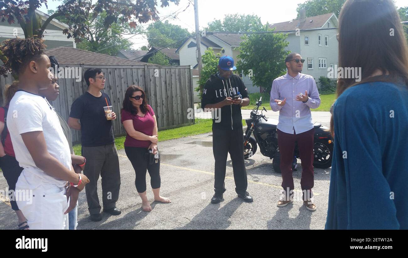 Community members gather May 28, 2017, at the scene of a fatal shooting ...