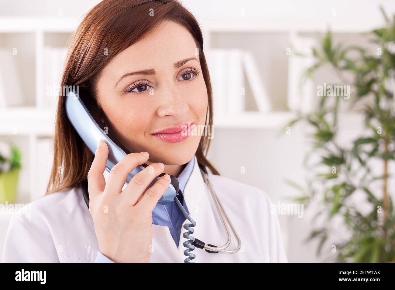 Smiling female patient doctor provides consultation to her patient ...