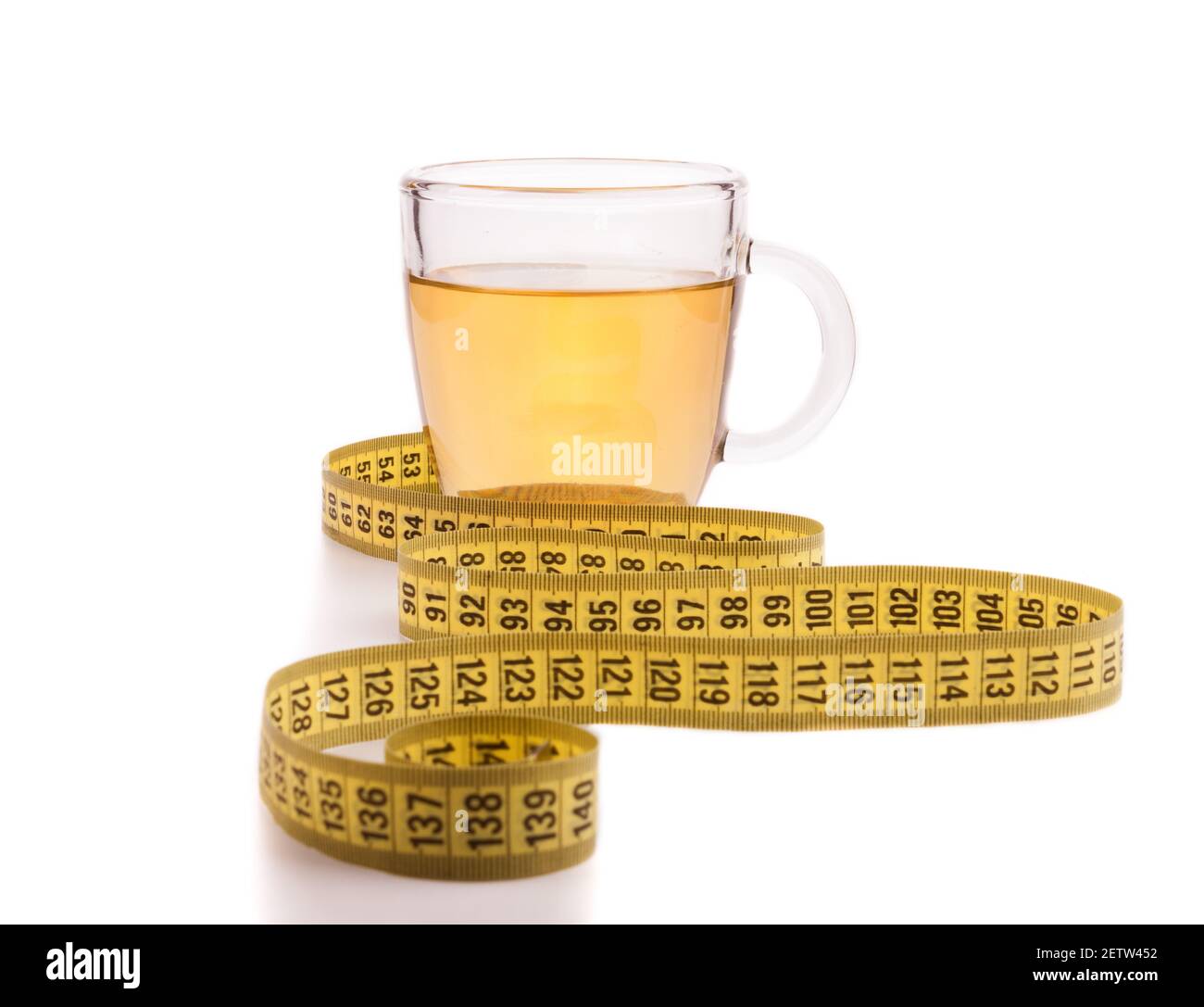 Slimming tea with meter isolated on white Stock Photo - Alamy