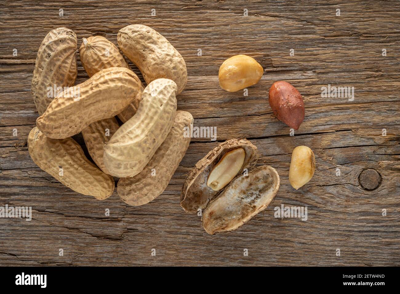 Peanut in a shell on wooden background. Food background. Top view Stock ...