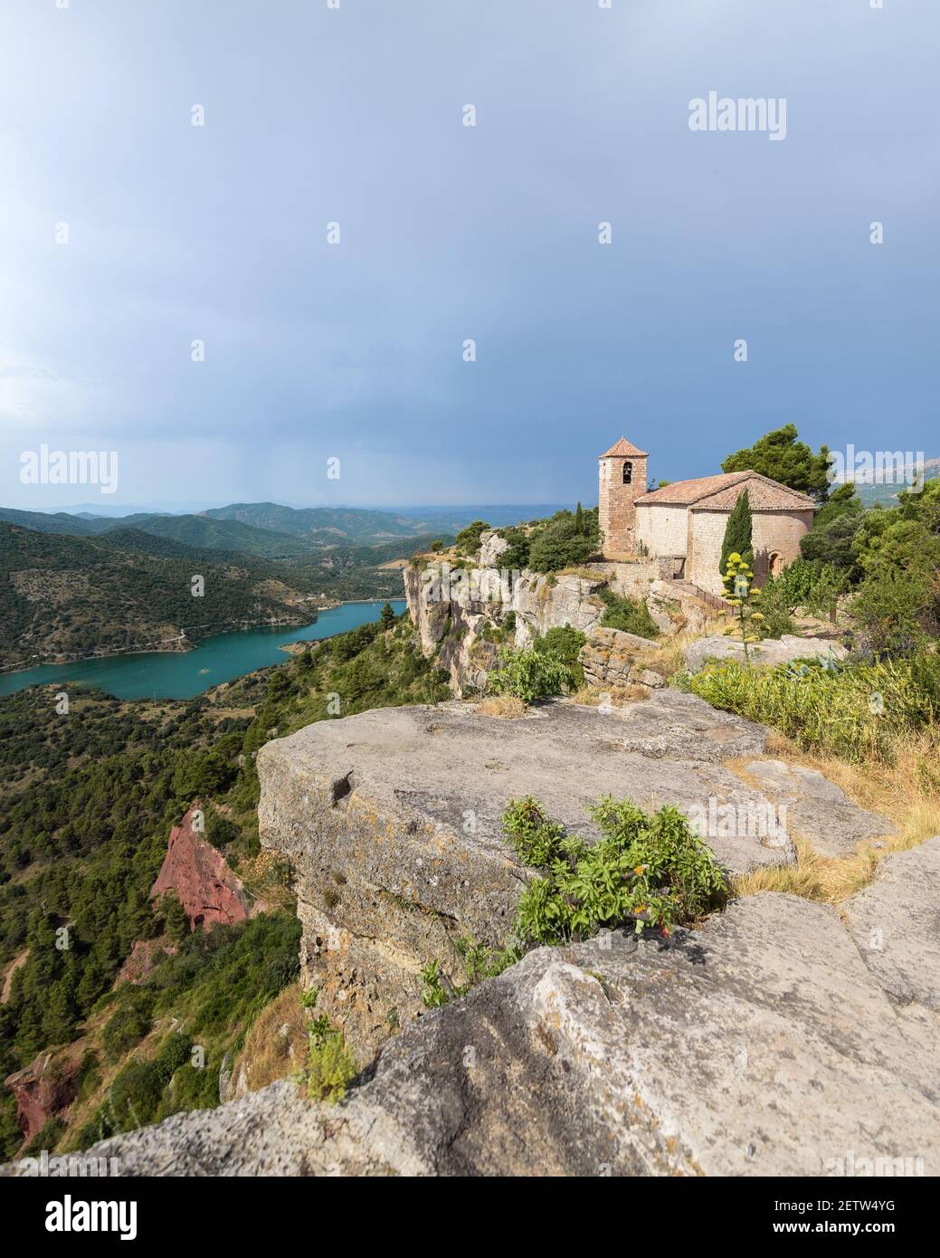 View of a medieval town's church on top of a cliff Stock Photo - Alamy