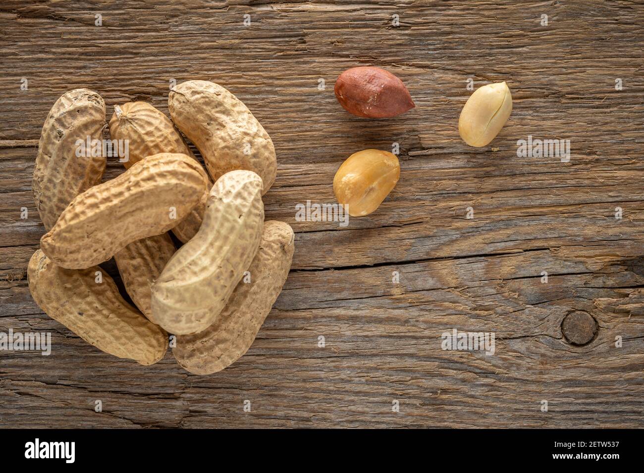 Peanut in a shell on wooden background. Food background. Top view Stock ...