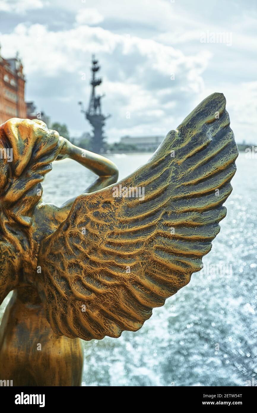 Antique golden statue angel figurehead decorative rostrum ship against ...