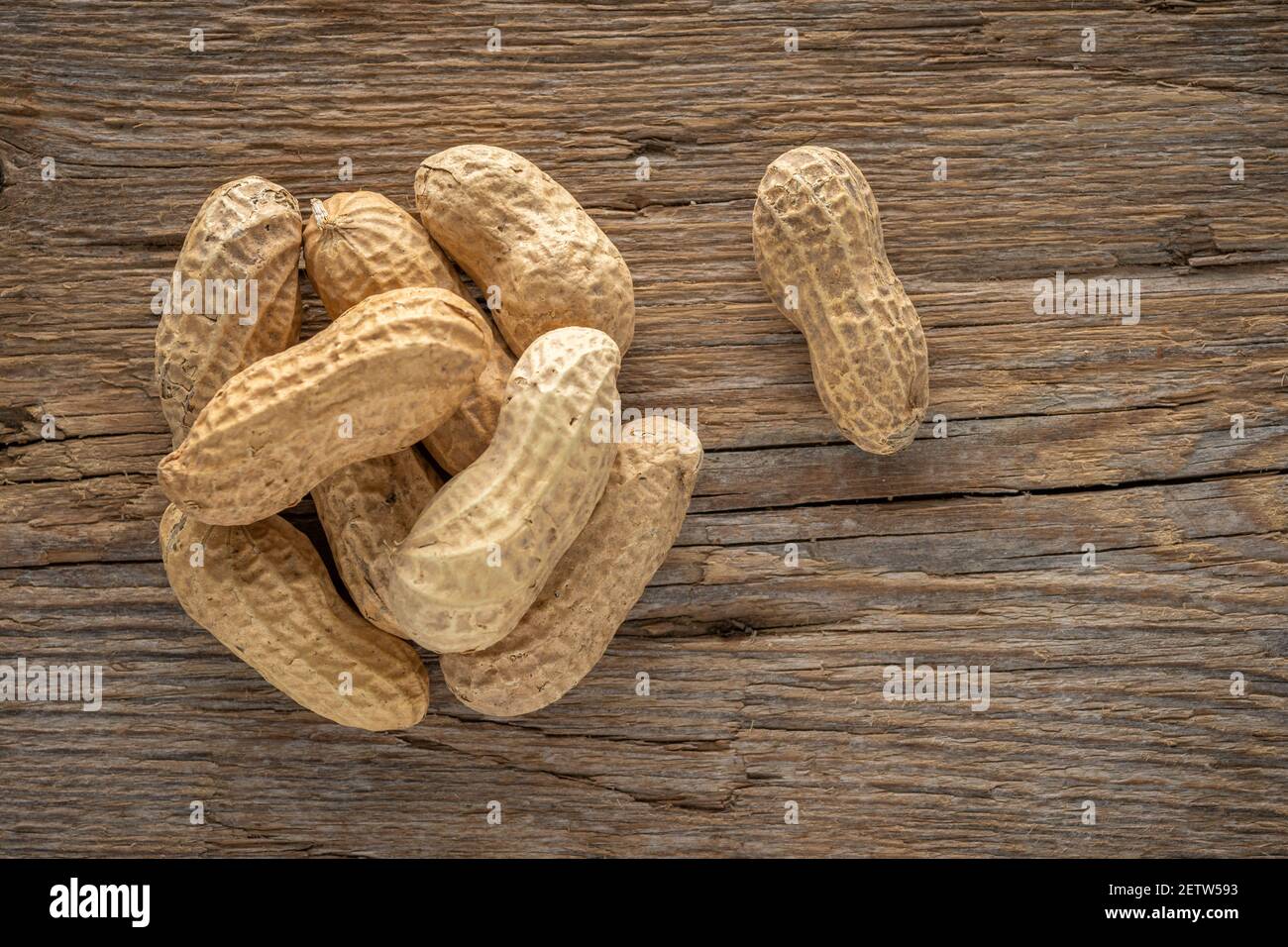 Peanut in a shell on wooden background. Food background. Top view Stock ...