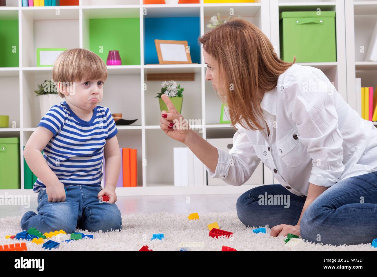 Angry mother scolding a disobedient child Stock Photo - Alamy