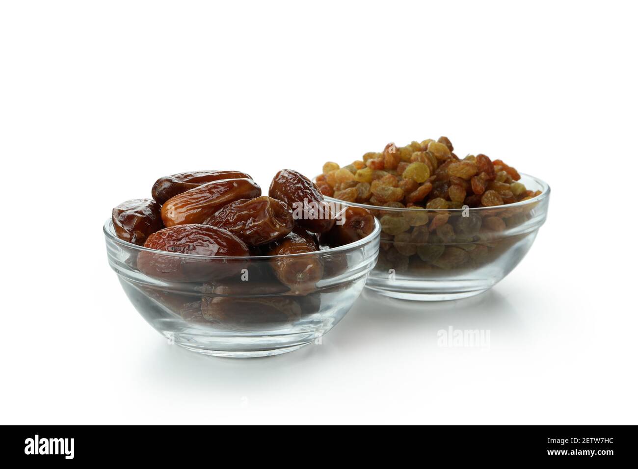 Bowls with dried dates and raisins isolated on white background Stock ...
