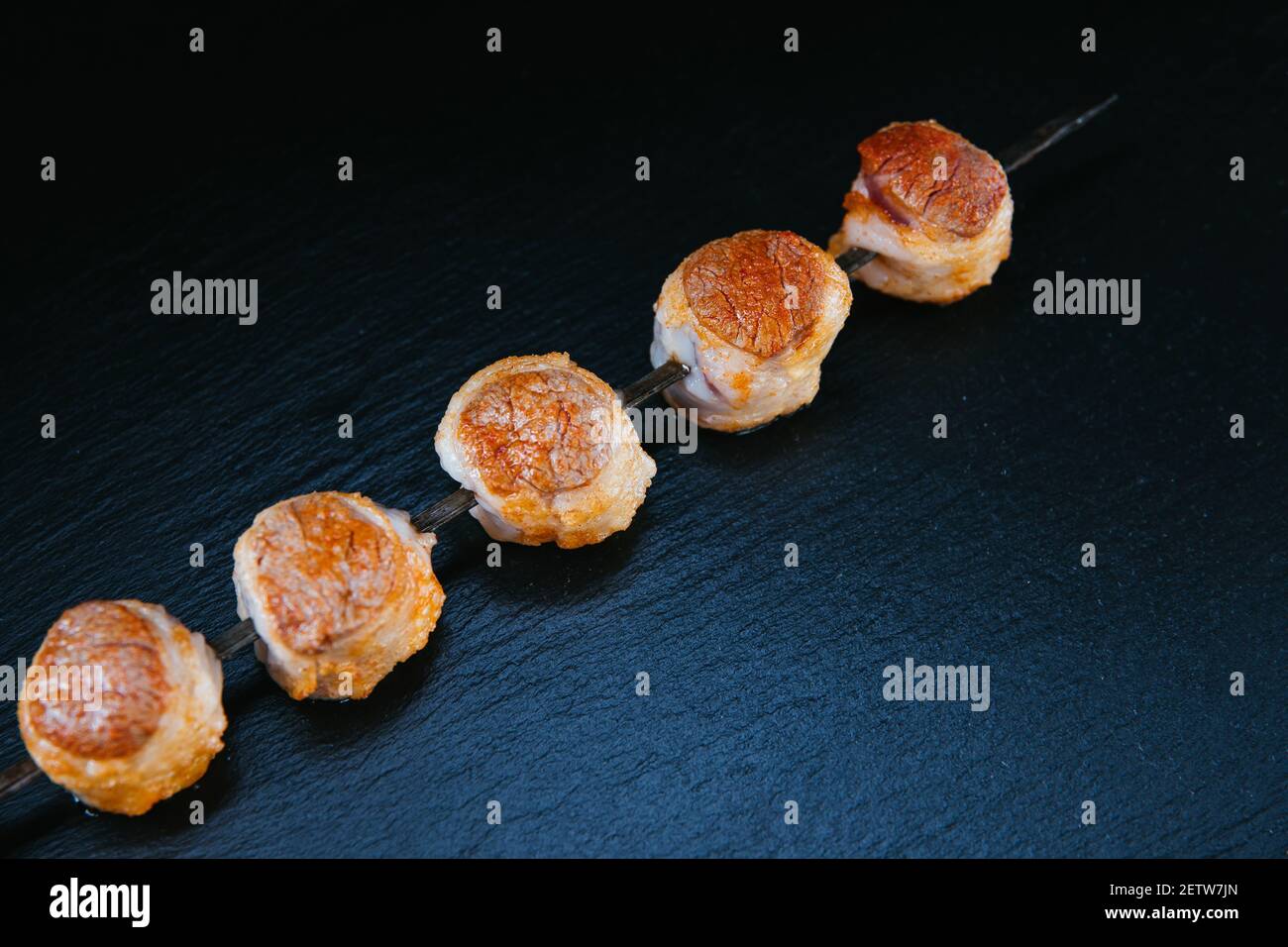 Skewers of grilled shish kebab or barbecued shashlik meat Stock Photo ...